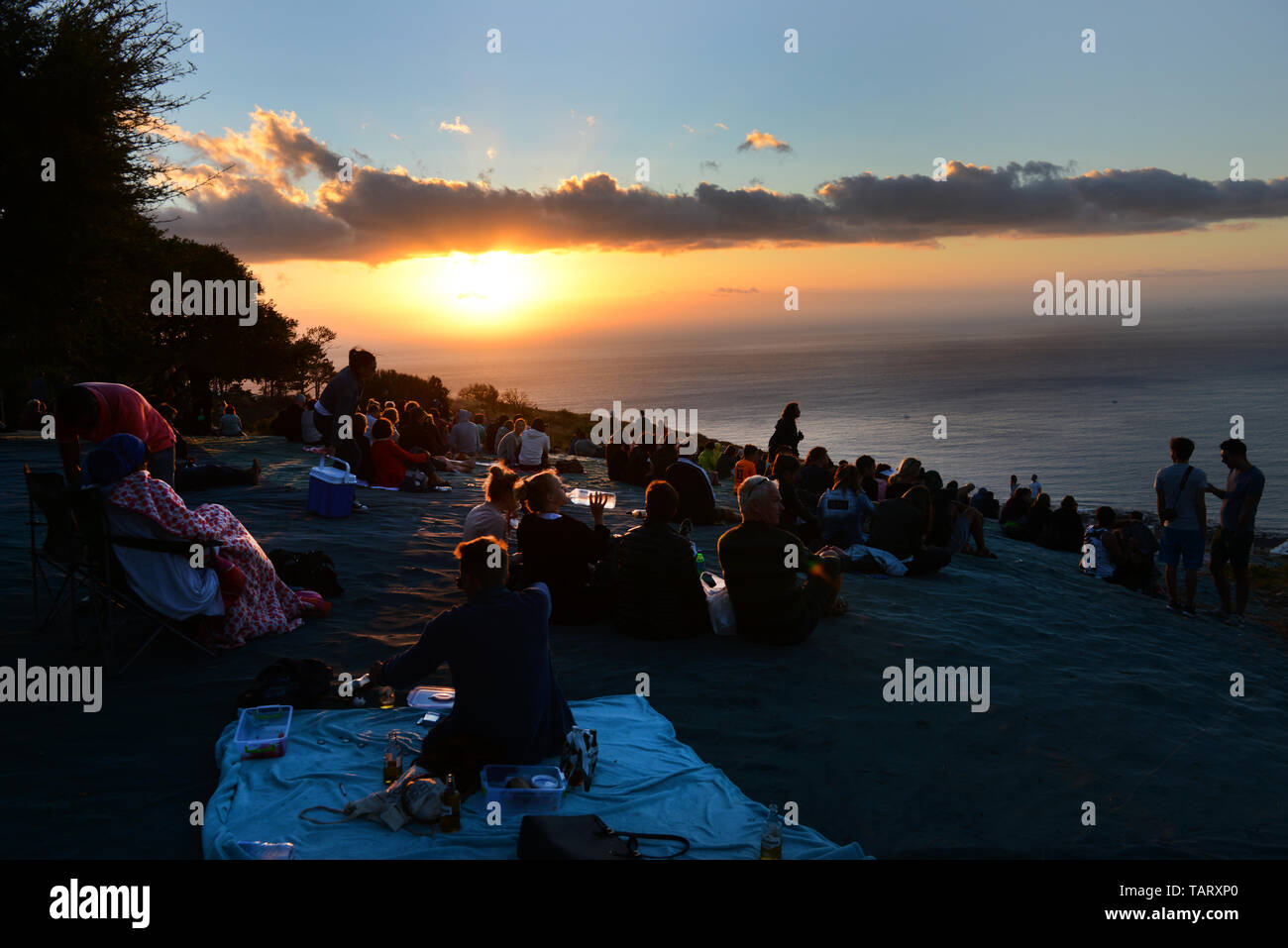 Locals and tourist enjoying the beautiful sunset from the top of Signal ...