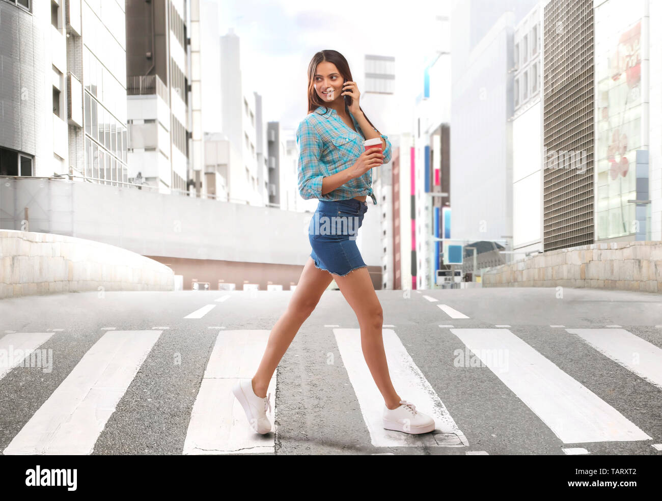 Indian woman crossing road hi-res stock photography and images - Alamy