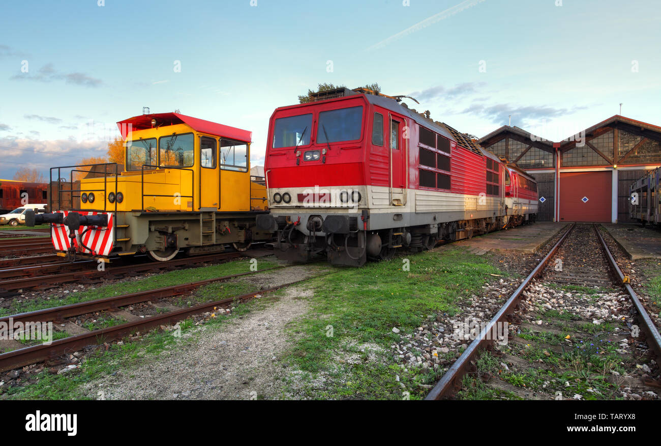 Two trains in depot at a day Stock Photo - Alamy