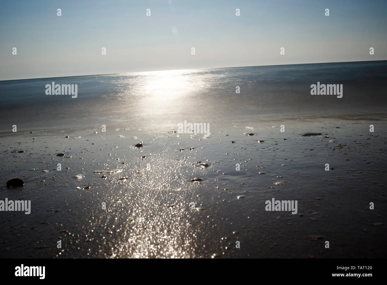 Beautiful moon like landscape taken at the beach with the shallow water ...