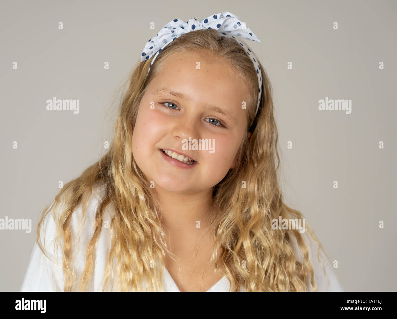 Cute charming happy excited and cheerful young kid modeling and posing ...