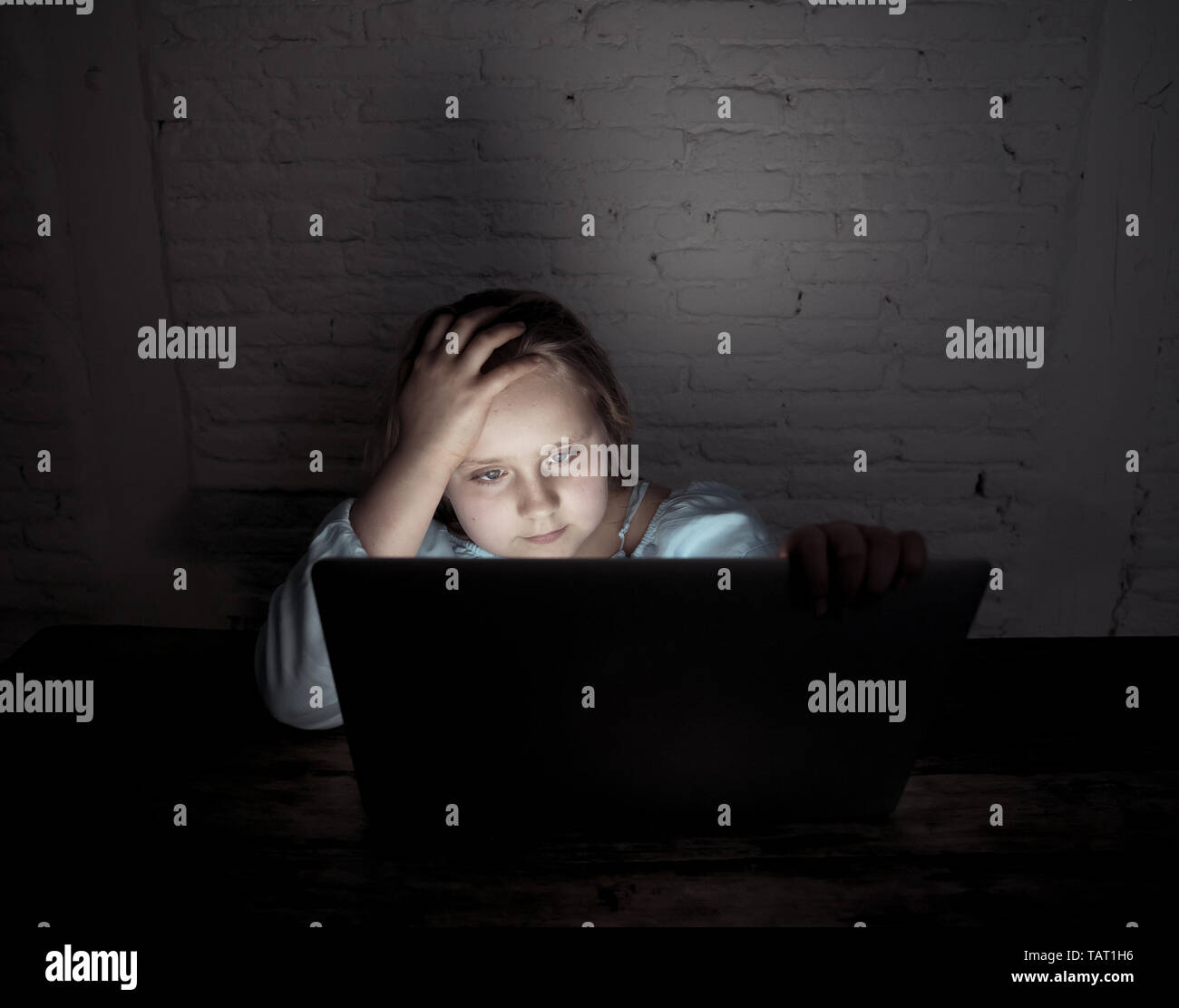 Scared sad girl bullied on line with laptop suffering cyber bullying ...