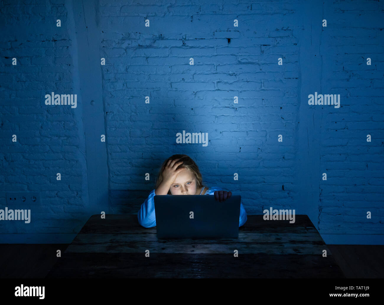 Scared sad girl bullied on line with laptop suffering cyber bullying ...