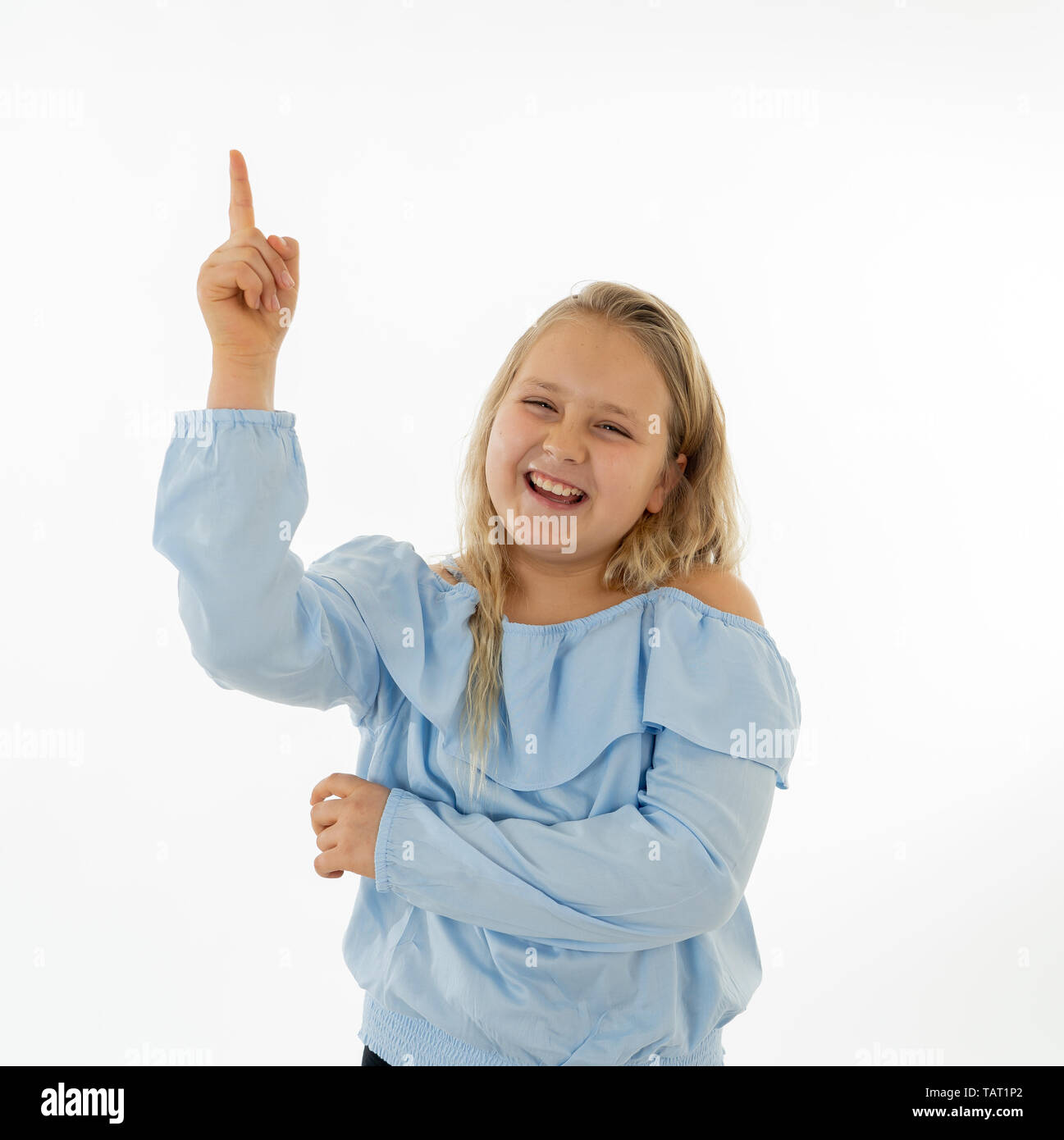 Cute excited, funny, cheerful young kid happy face finger pointing out ...