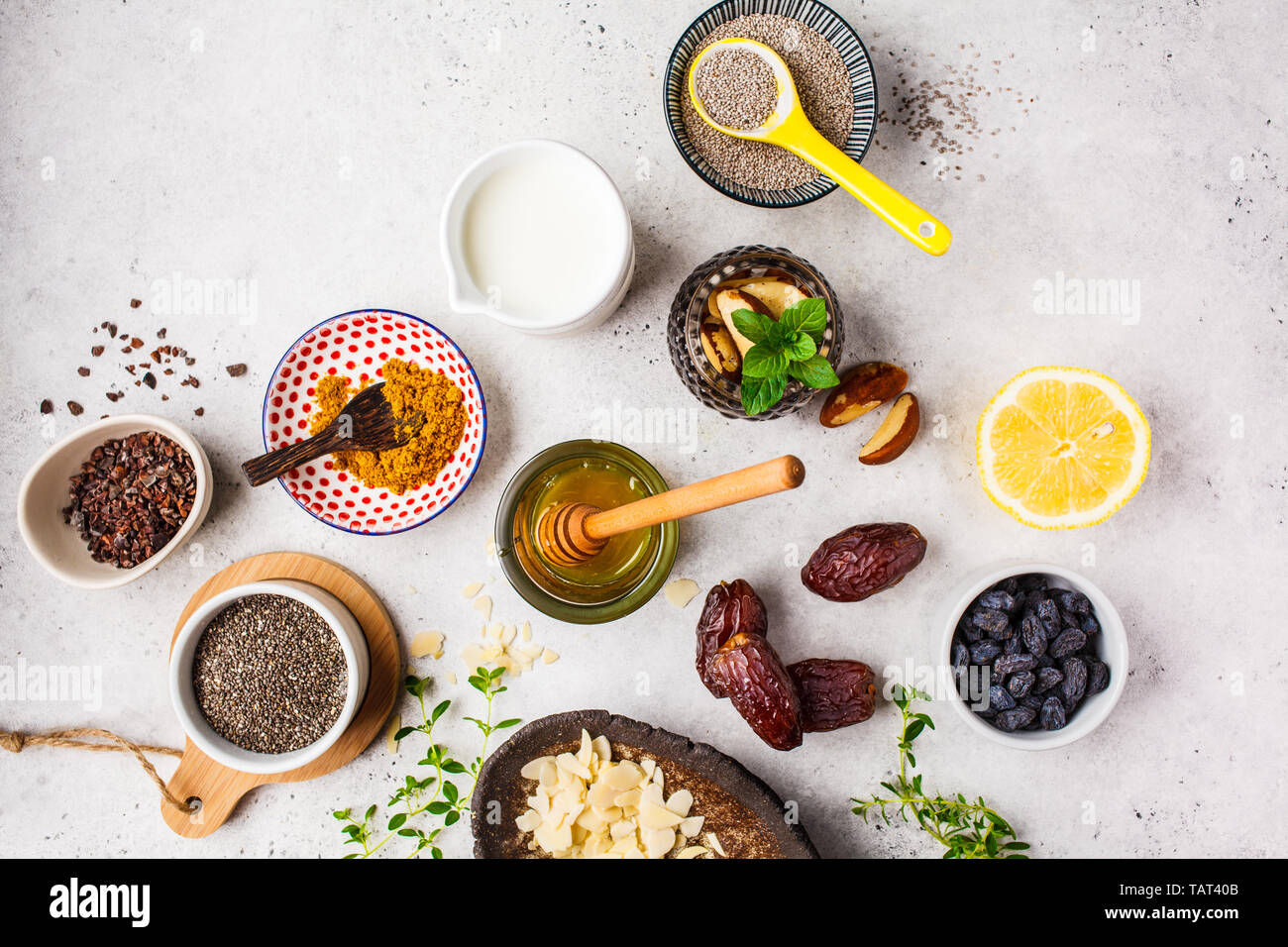 Flt lay of super foods - honey, dates, milk, turmeric, lemon, nuts and ...