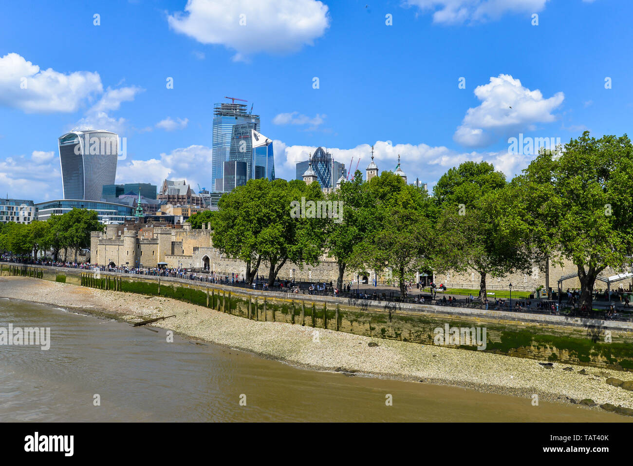 The iconic Tower of London with modern skycrapers behind it - London ...
