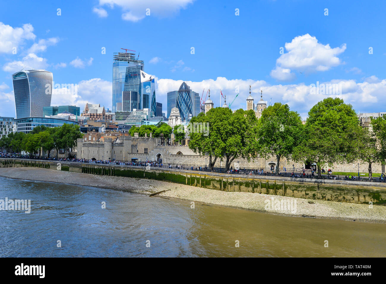 The iconic Tower of London with modern skycrapers behind it - London ...