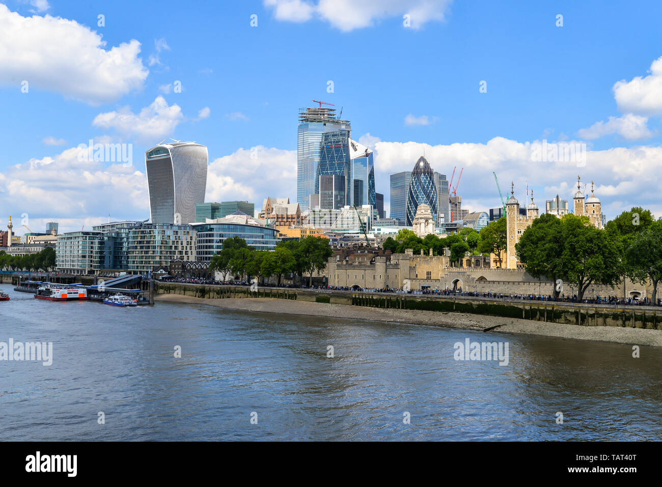 The iconic Tower of London with modern skycrapers behind it - London ...