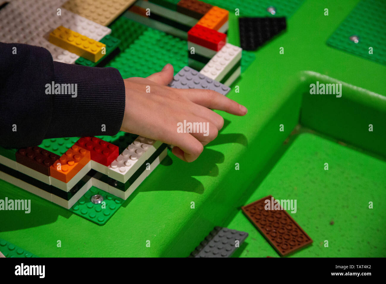 Child's hands building with Lego bricks Stock Photo - Alamy