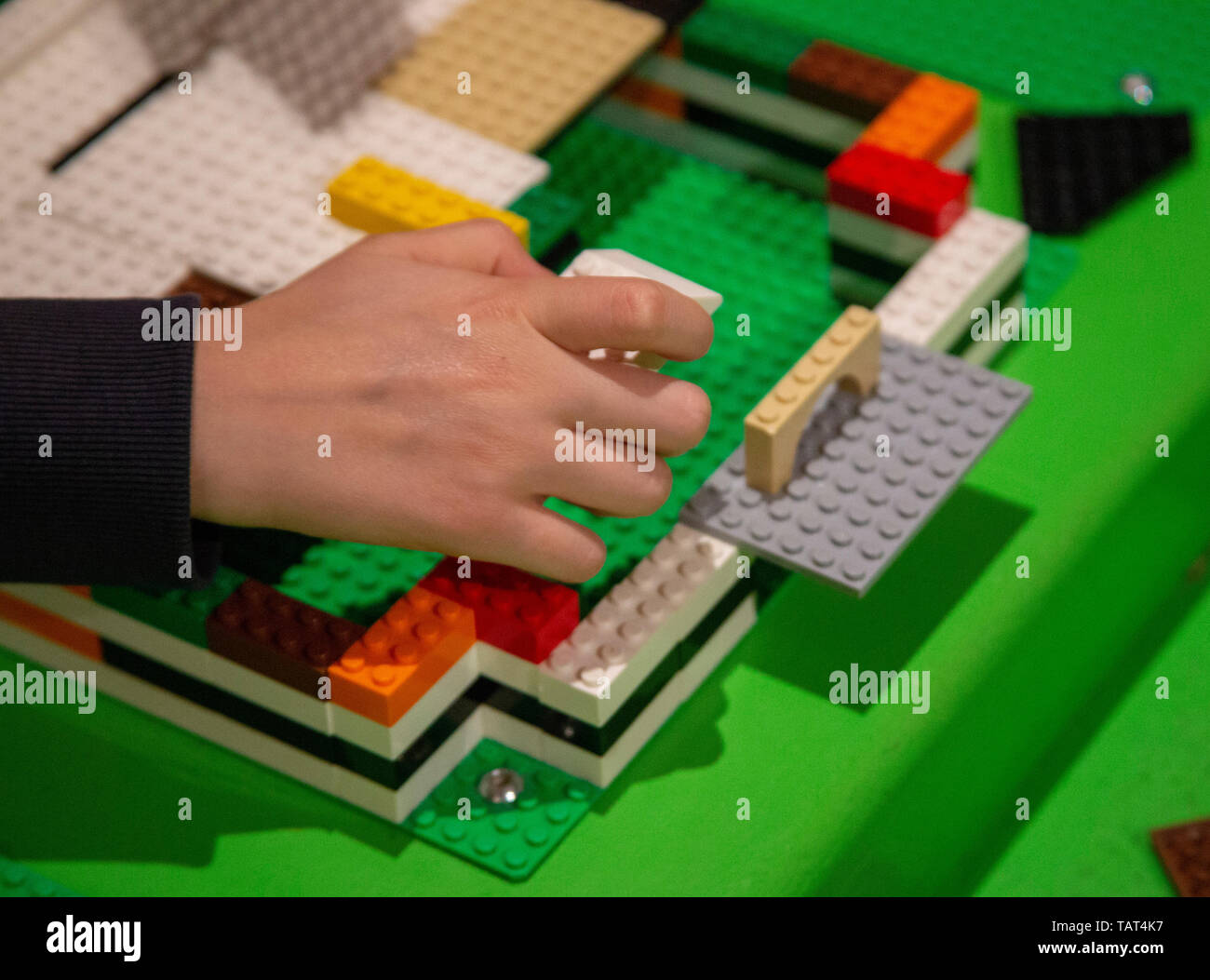 Child's hands building with Lego bricks Stock Photo - Alamy