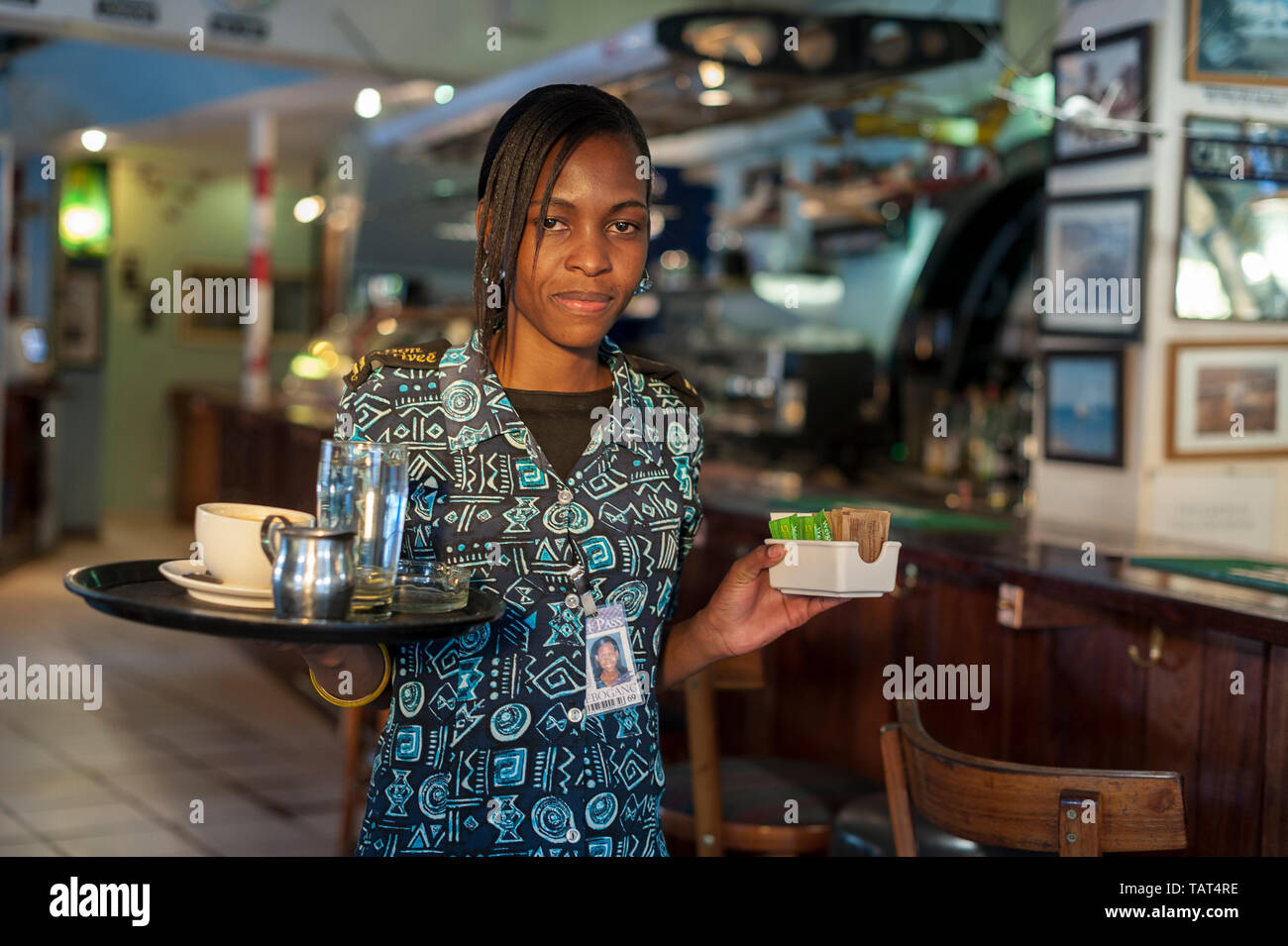Waitress in blue uniform hi-res stock photography and images - Alamy