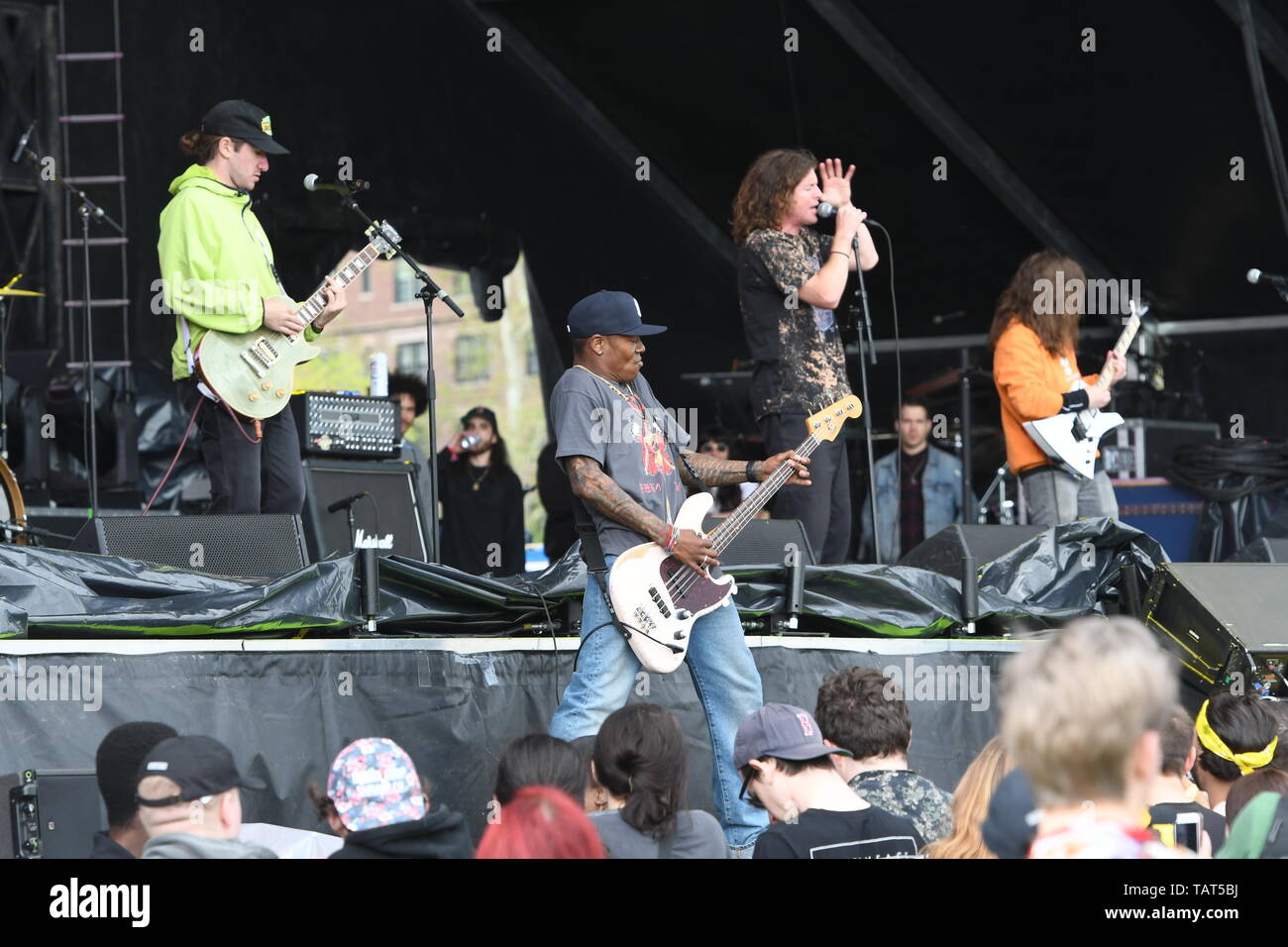 Turnstile is shown performing on stage during a "live" stand up ...
