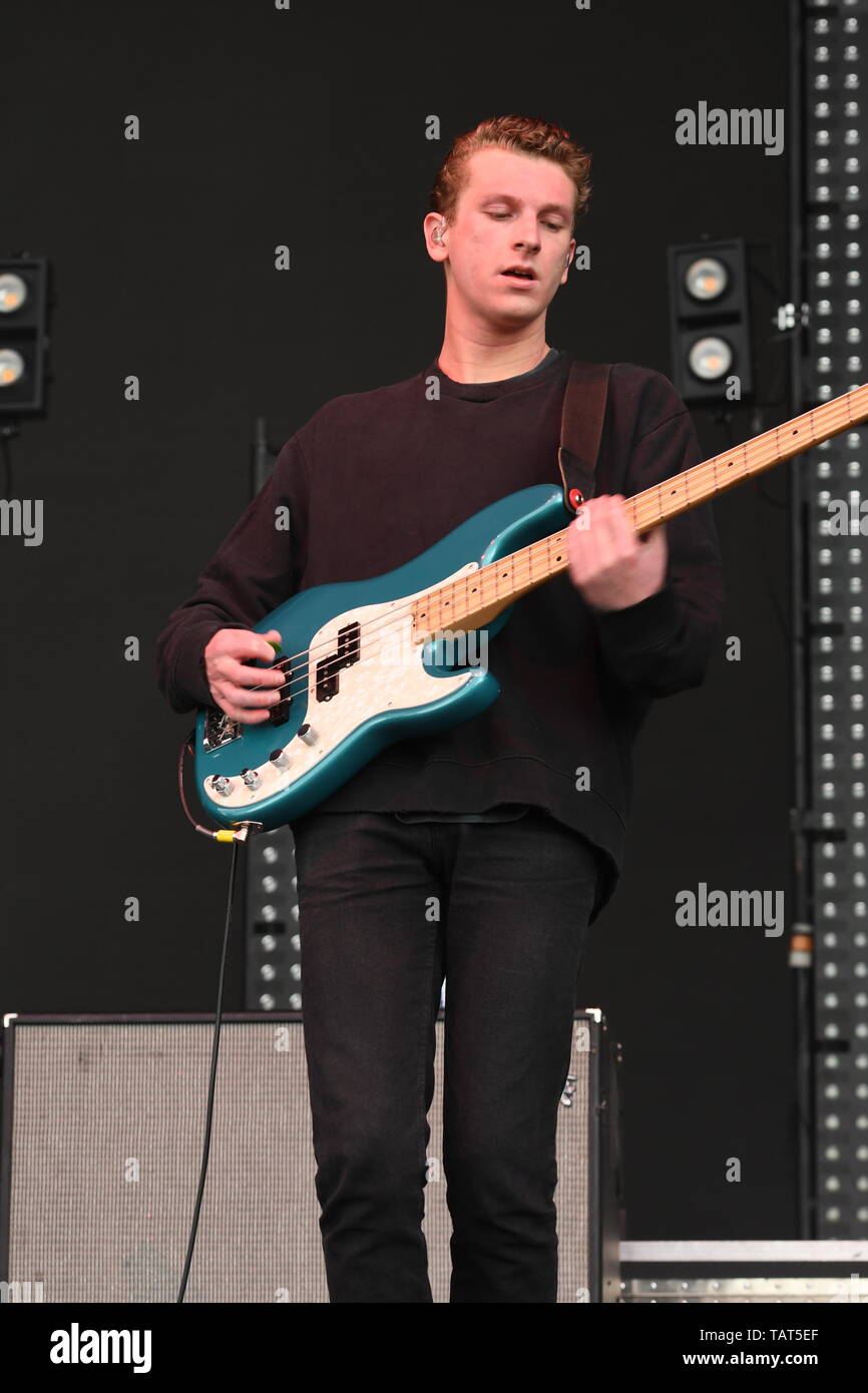Bass guitarist Charlie Wood is shown performing on stage during a "live ...