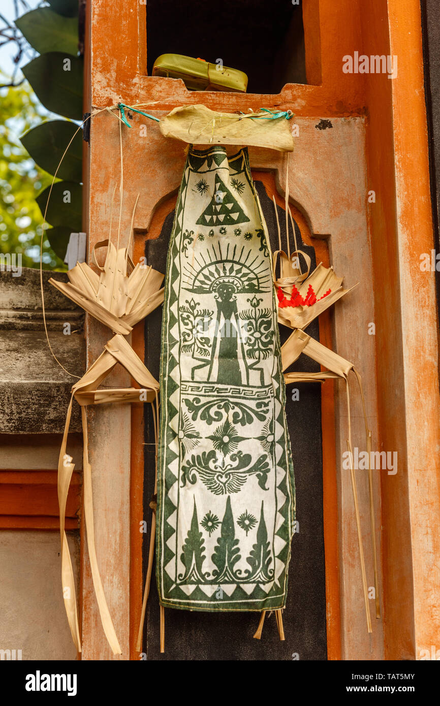 Balinese Hindu weaved altar decoration gantung-gantungan and a fabric ...