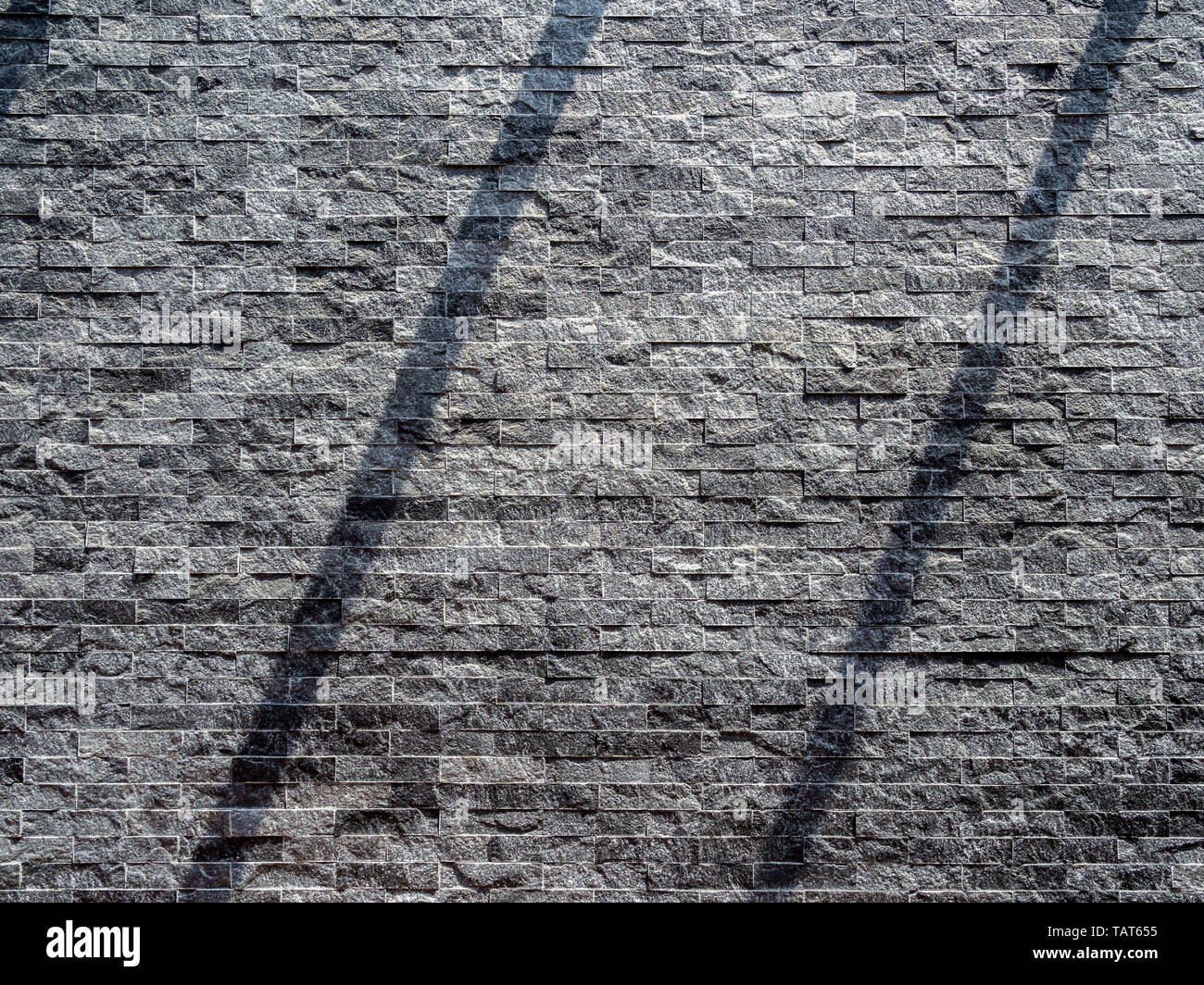 Modern grey brick wall texture background. Shadow shade light on stone ...