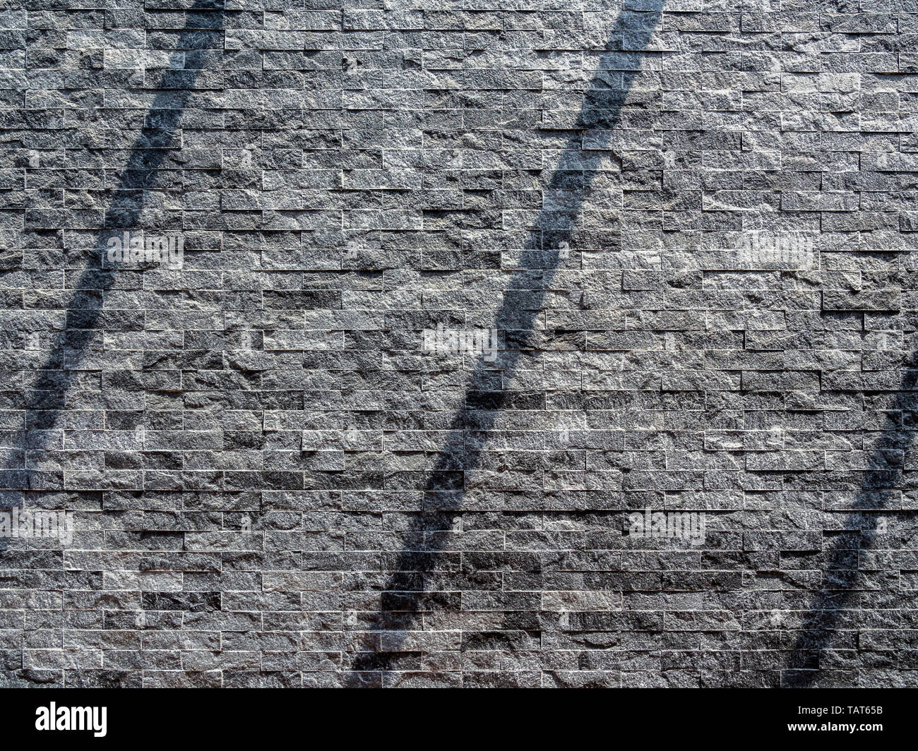 Modern grey brick wall texture background. Shadow shade light on stone ...
