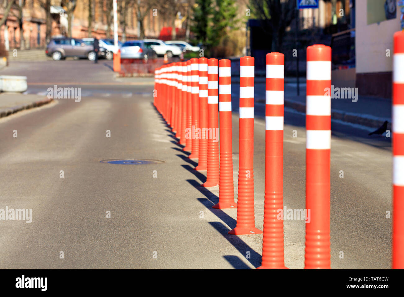 Red reflective road columns divide the road in half amid the entrance ...