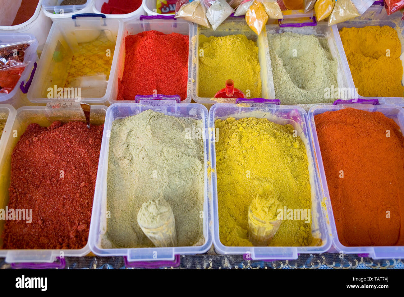 Multi-colored seasonings in containers on the counter. Georgia Stock ...
