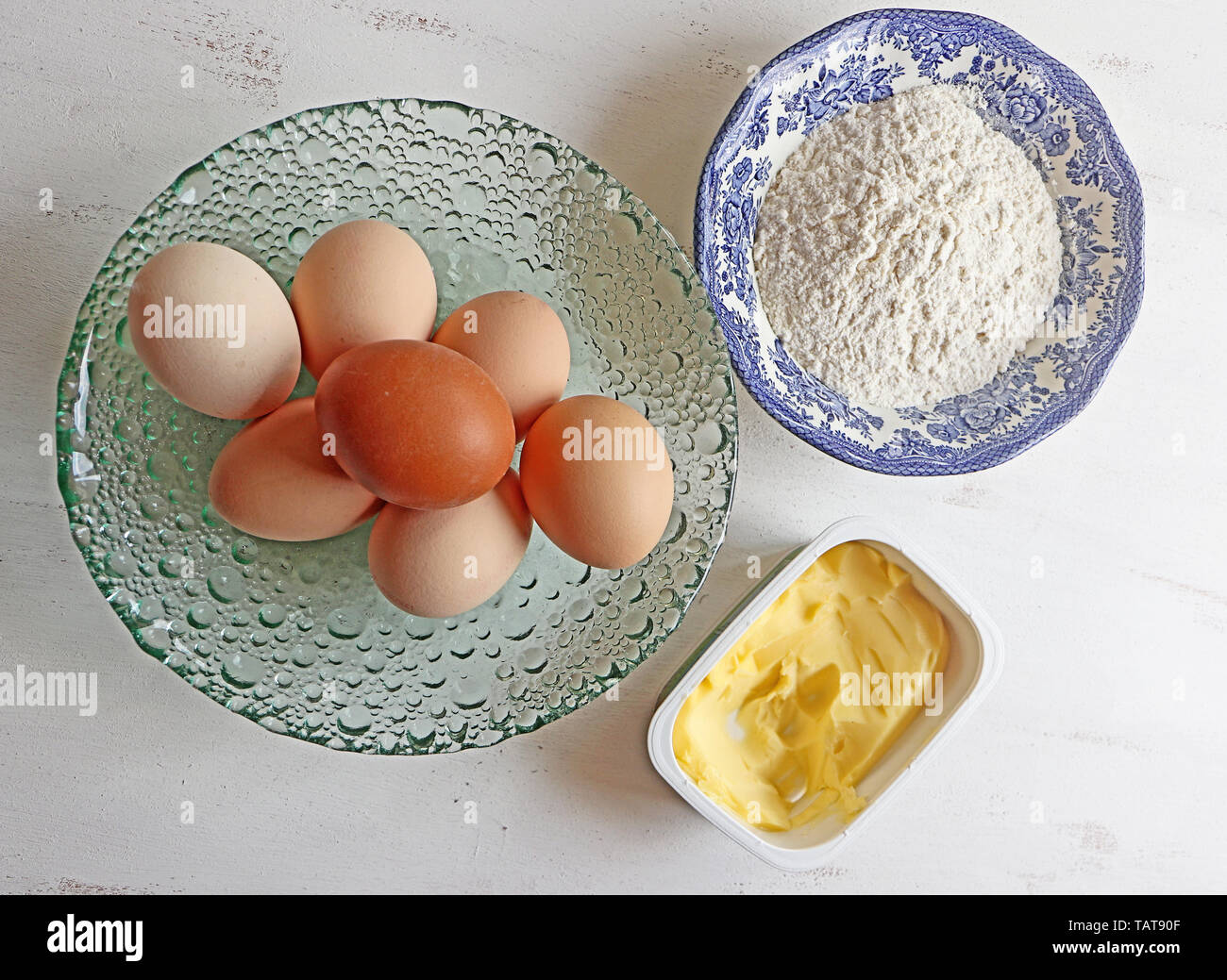 Ingredients ready for a cake: fresh eggs, butter and flour Stock Photo ...