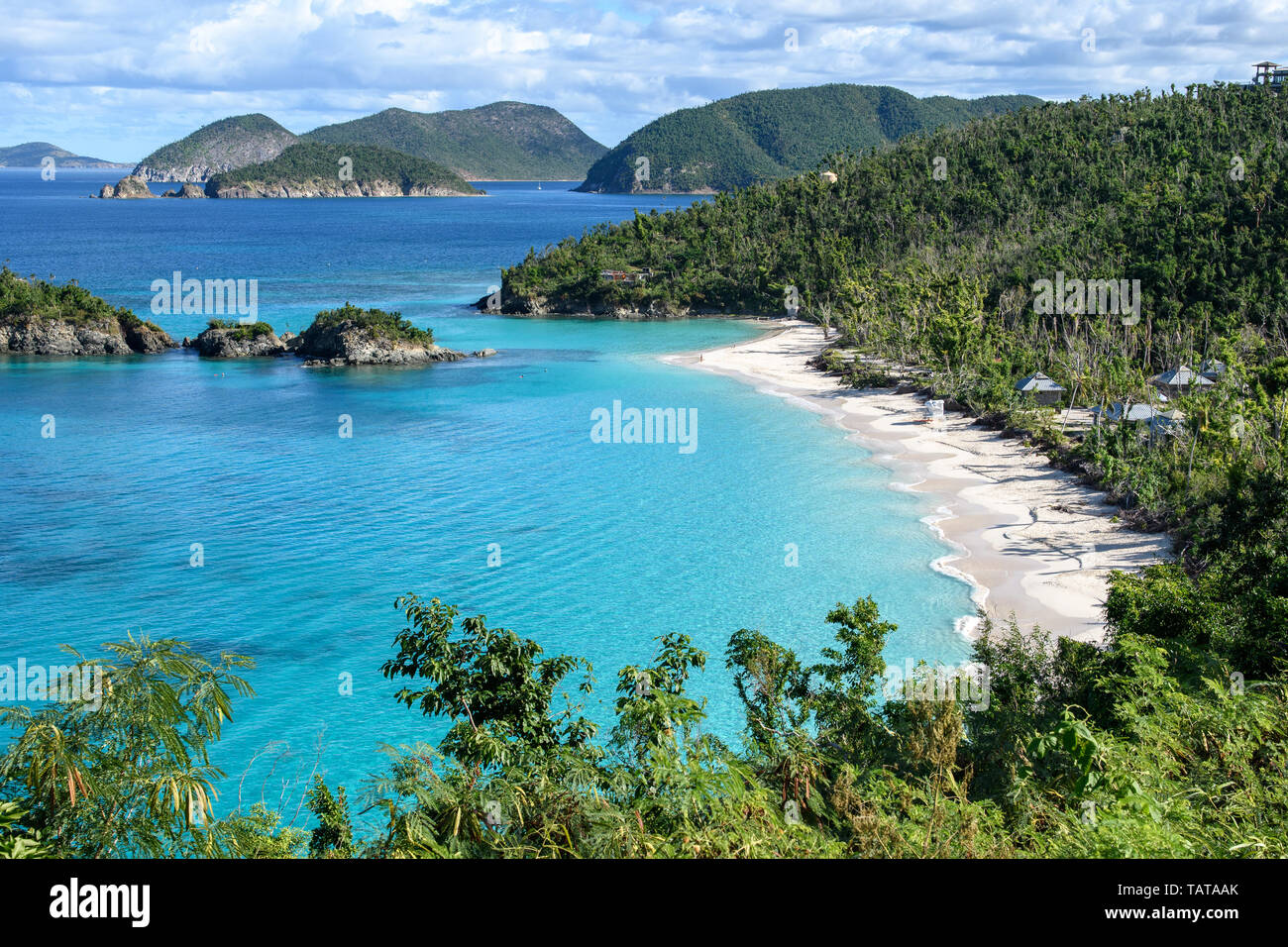 Blue lagoon with white sandy beach, green jungle and Islands on the ...
