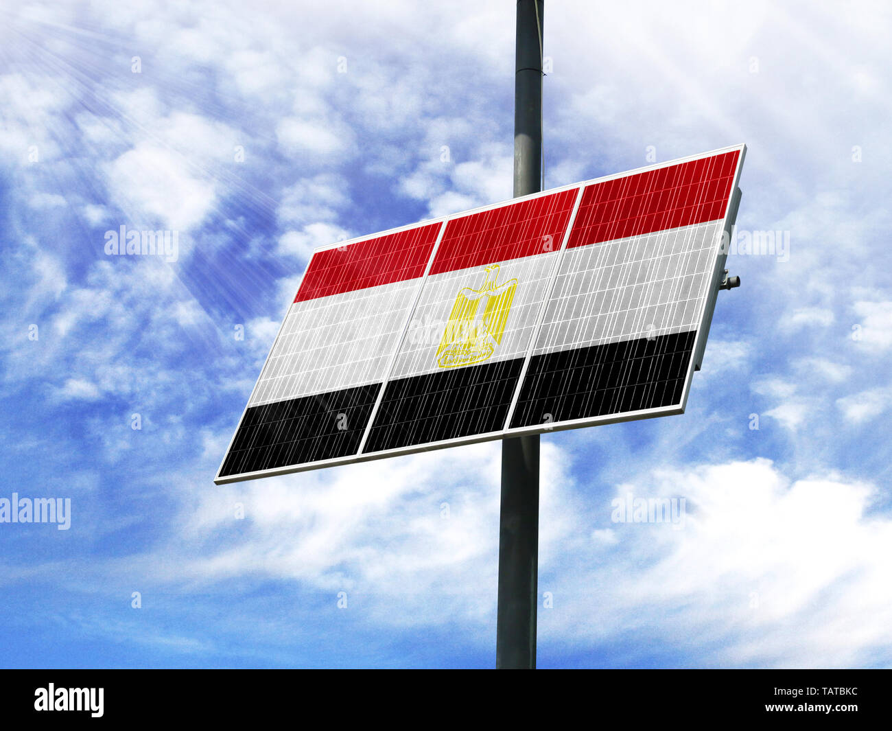Solar panels against a blue sky with a picture of the flag of Egypt ...