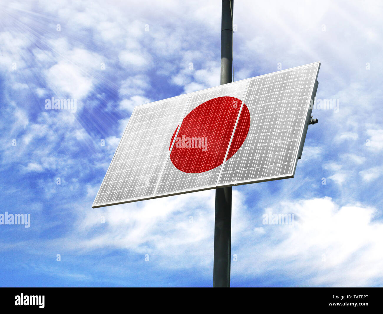 Solar panels against a blue sky with a picture of the flag of Japan ...