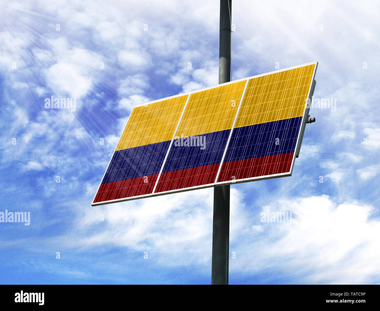 Solar panels against a blue sky with a picture of the flag of Colombia ...