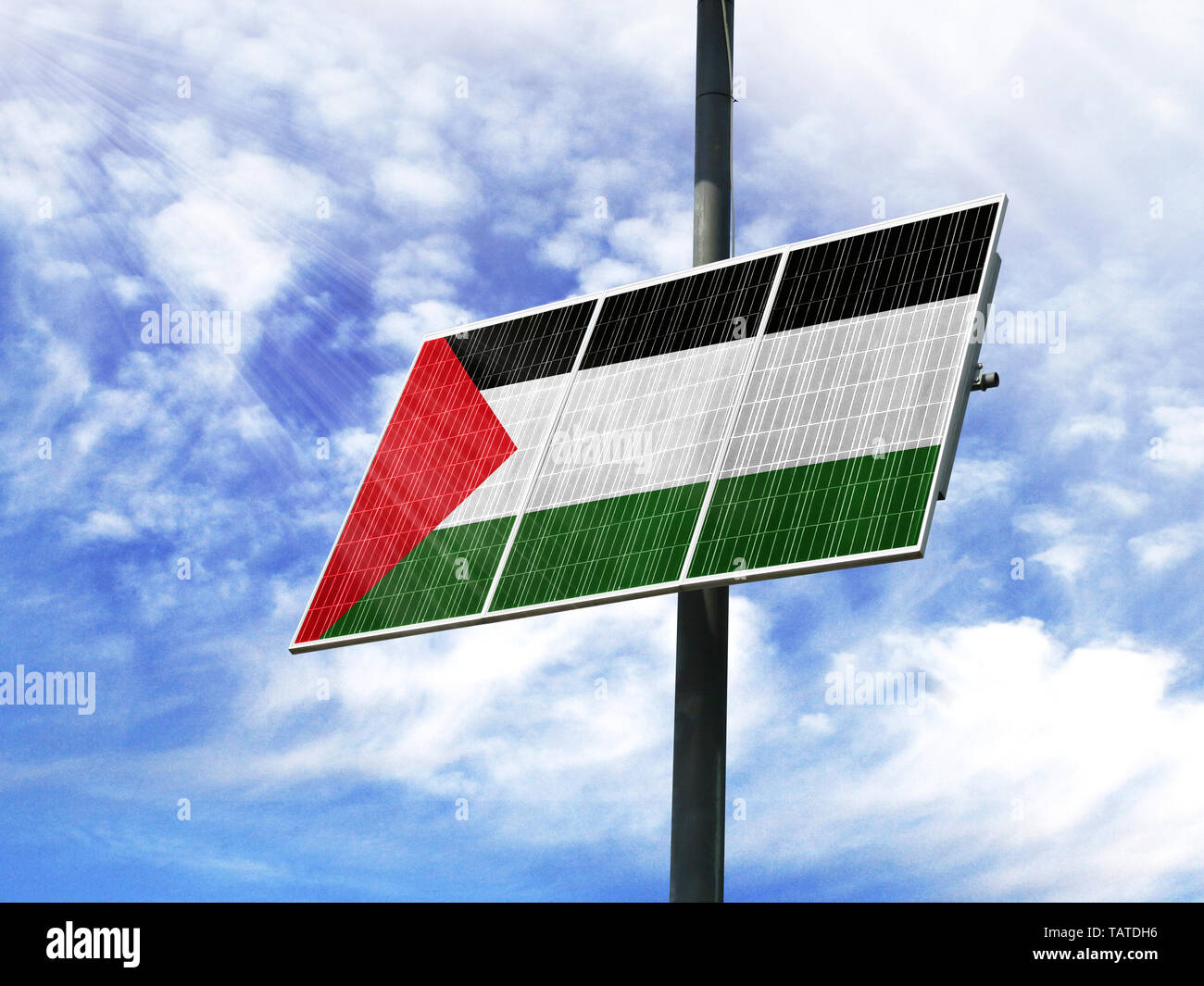 Solar panels against a blue sky with a picture of the flag of Palestine ...