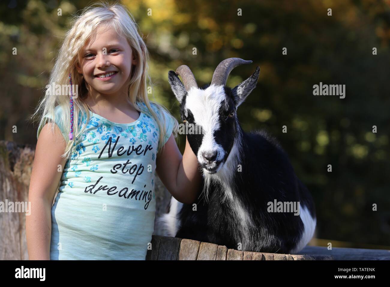 girl and goat Stock Photo - Alamy