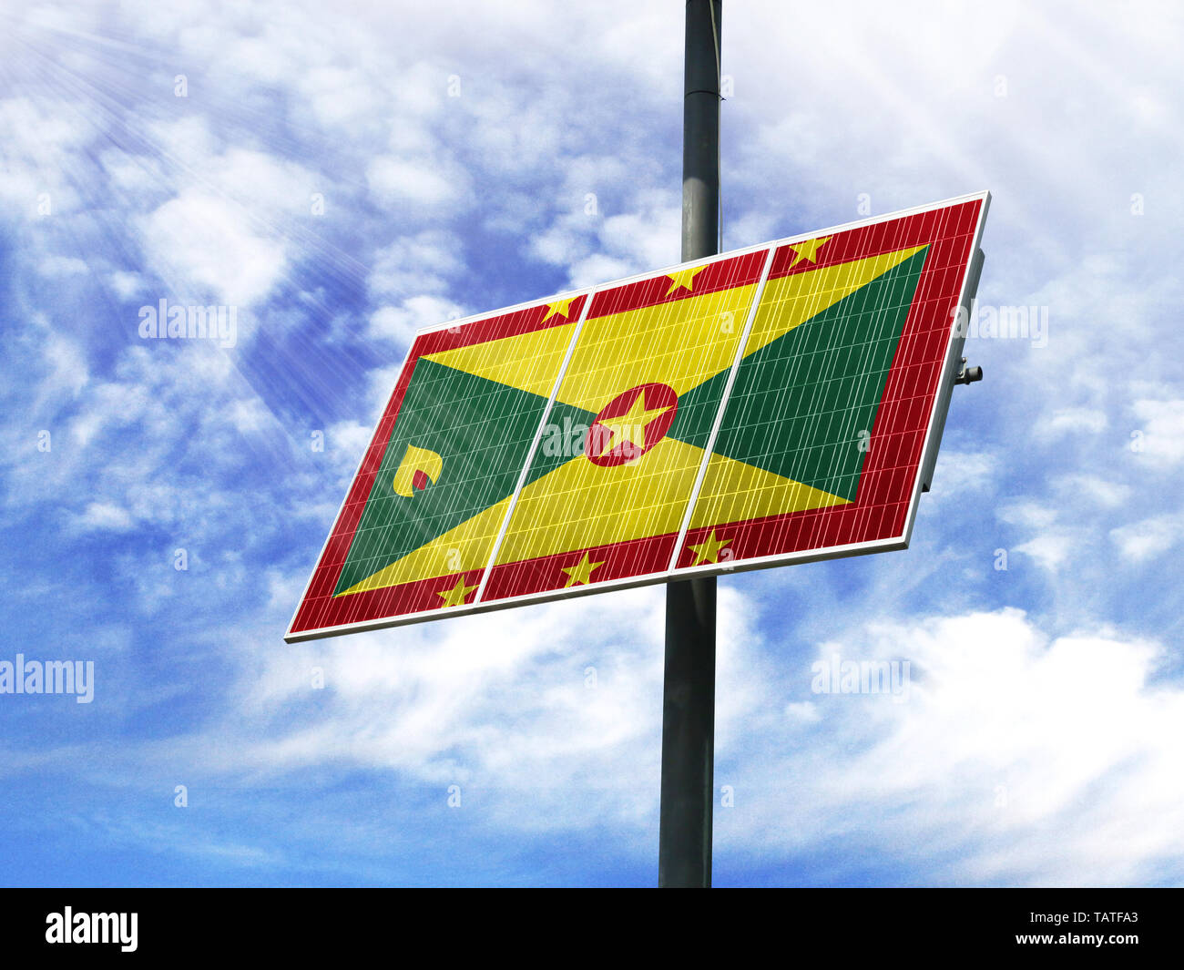 Solar panels against a blue sky with a picture of the flag of Grenada ...