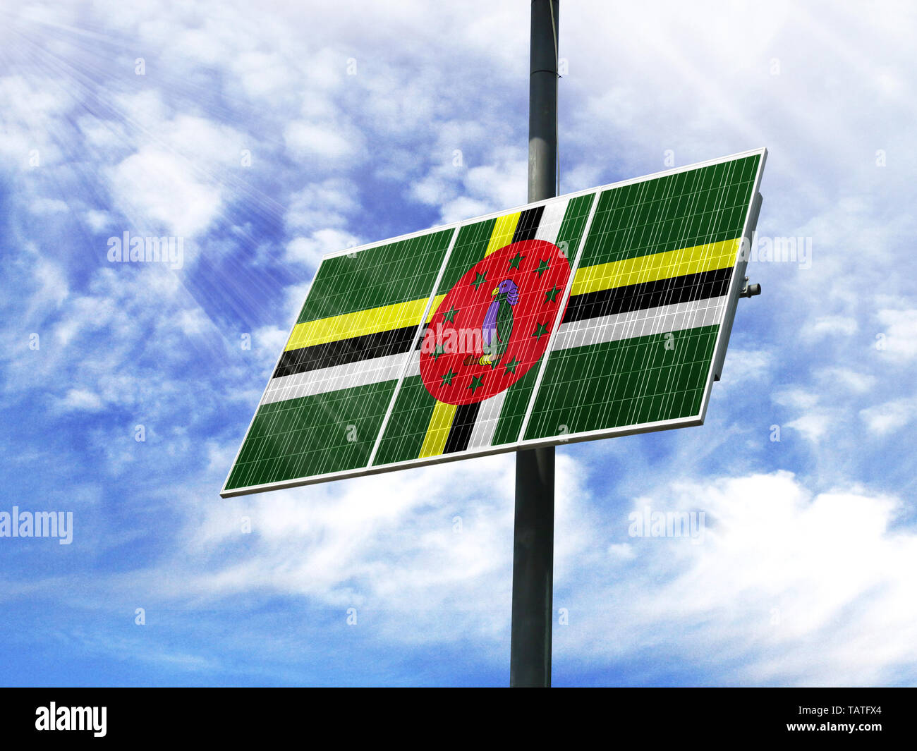 Solar panels against a blue sky with a picture of the flag of Dominica ...