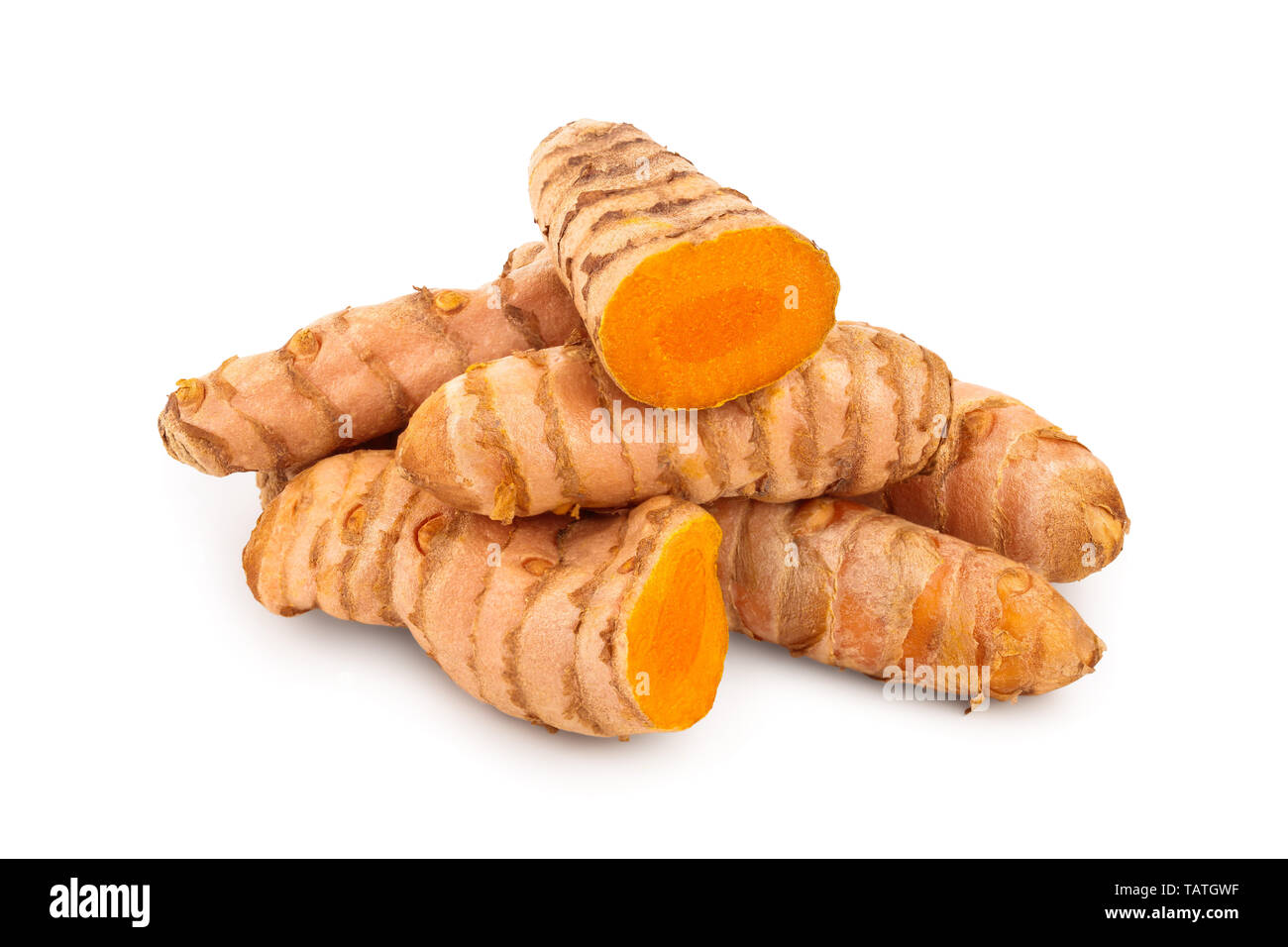 turmeric root isolated on white background close up Stock Photo - Alamy