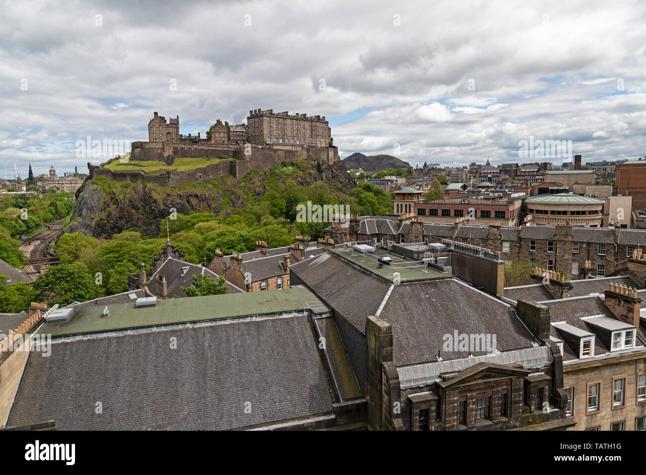 Looking across roof tops towards Edinburgh Castle in Scotland.with the ...