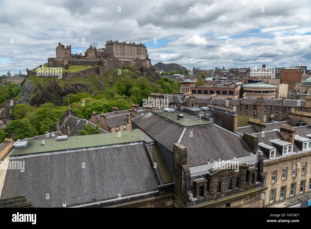 Looking across roof tops towards Edinburgh Castle in Scotland.with the ...