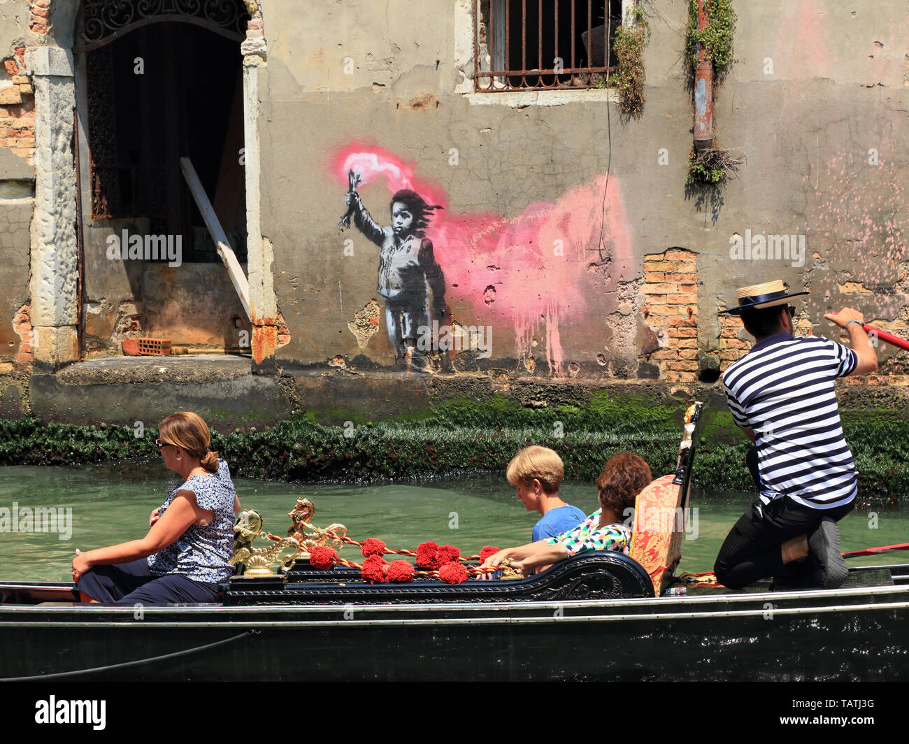 The shipwrecked migrant child graffiti by Banksy, Venice 2019 Stock ...