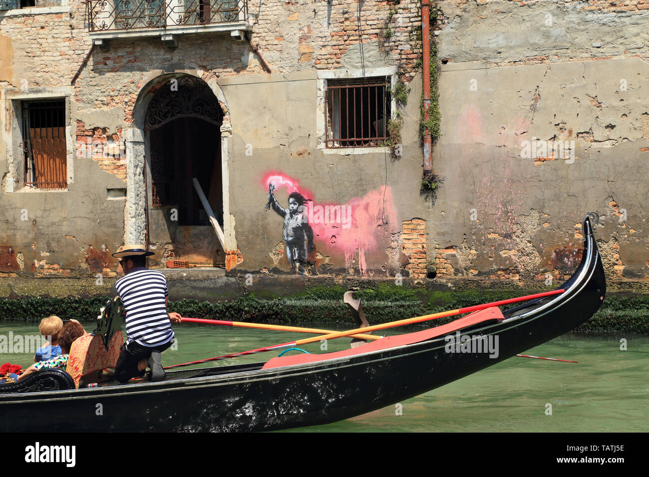 The shipwrecked migrant child graffiti by Banksy, Venice 2019 Stock ...