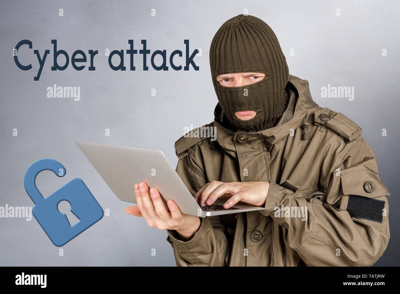 Hacker using laptop Stock Photo - Alamy