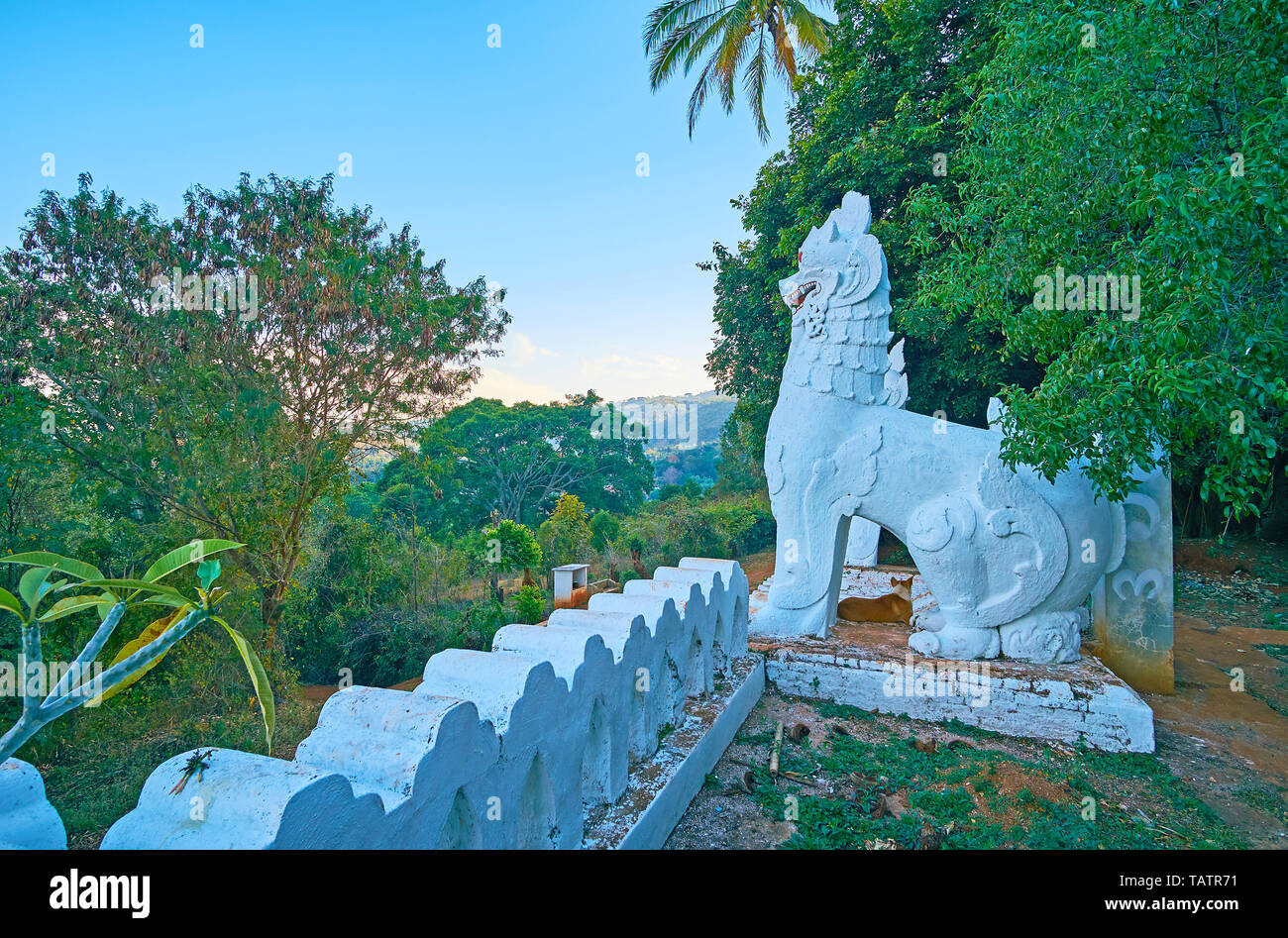The white statues of chinthe guards (lion, leogryph) in garden of old ...
