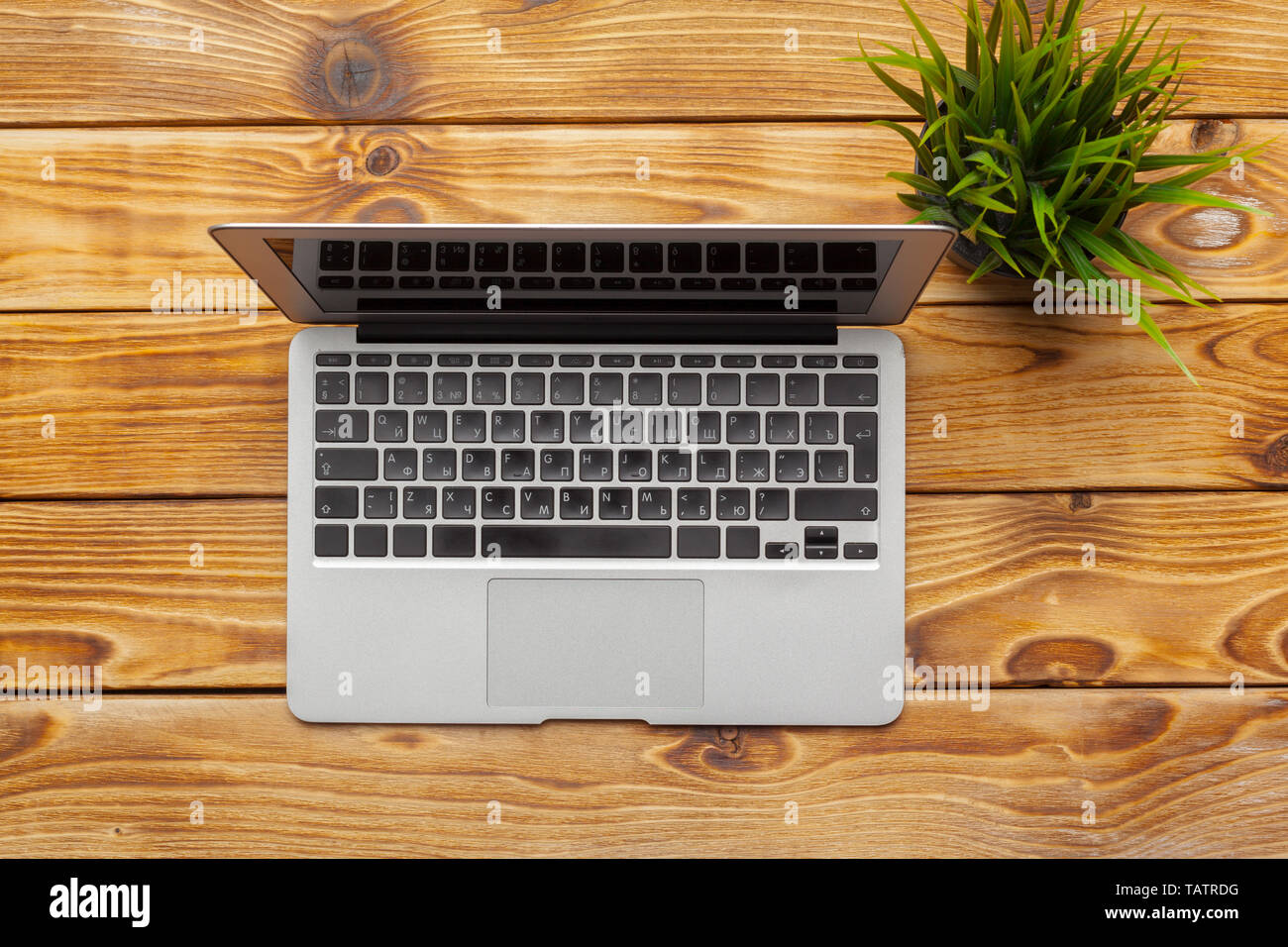 Laptop, notebook on work wooden desk Stock Photo - Alamy