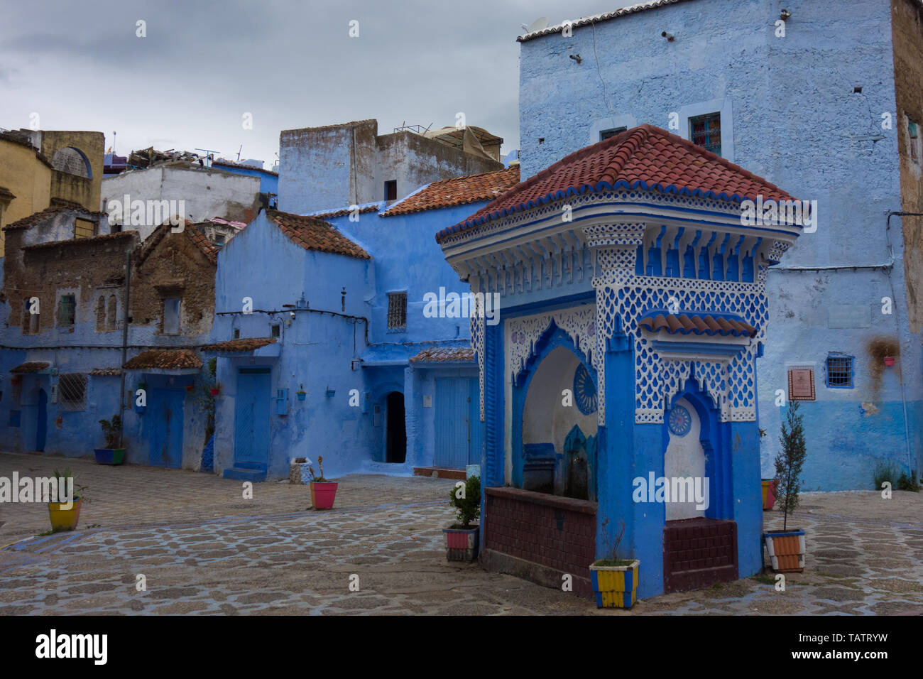 Traditional moroccan architectural details on a square with water well ...