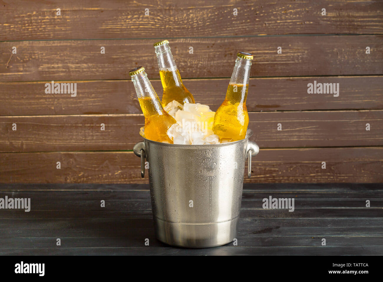 Ice bucket with beer Stock Photo - Alamy