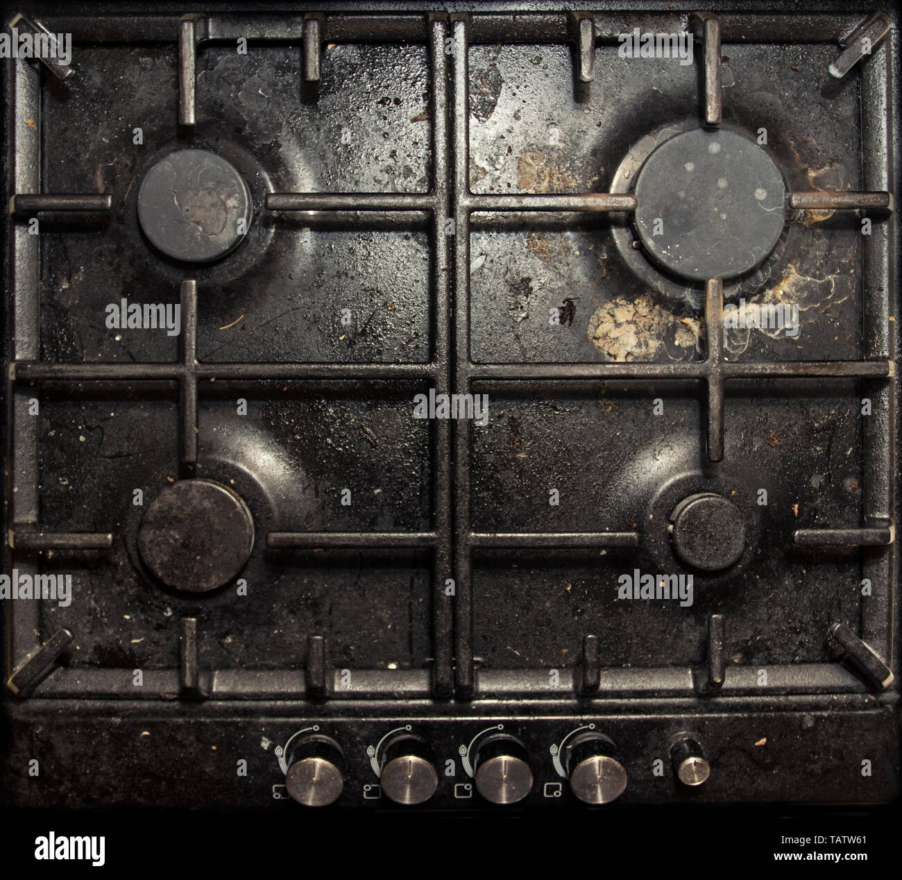 Very dirty gas cooking hob Stock Photo - Alamy
