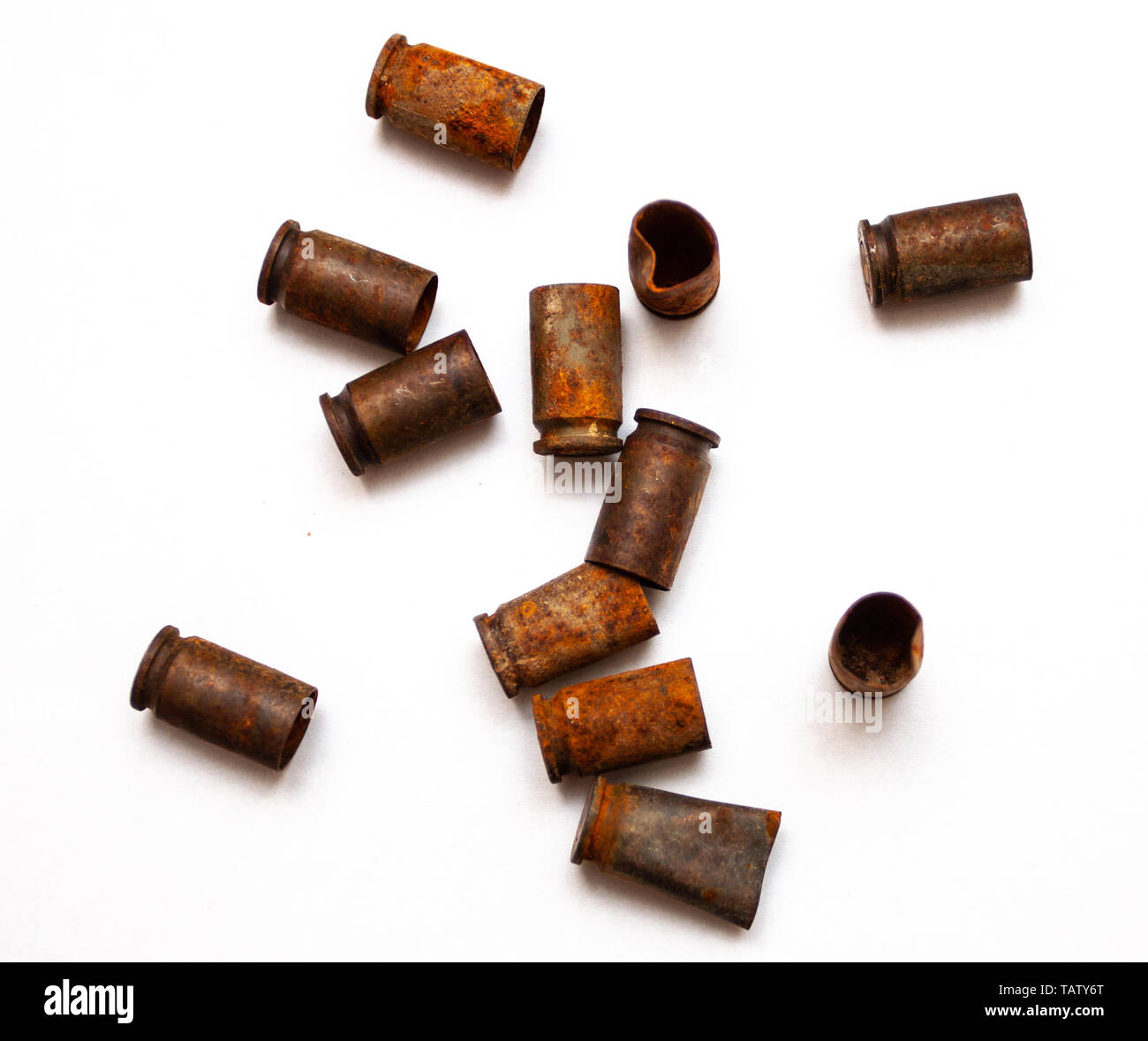 Empty bullet shells on a white background Stock Photo - Alamy