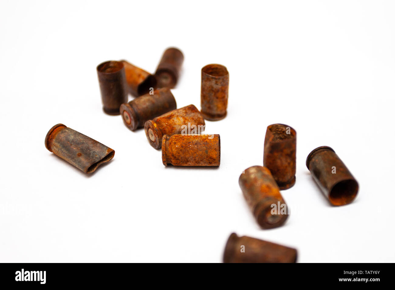 Empty bullet shells on a white background Stock Photo - Alamy