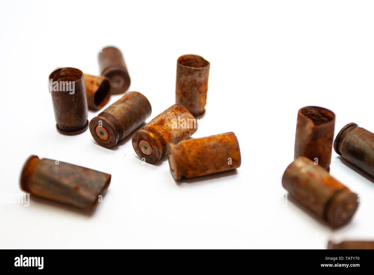 Empty bullet shells on a white background Stock Photo - Alamy