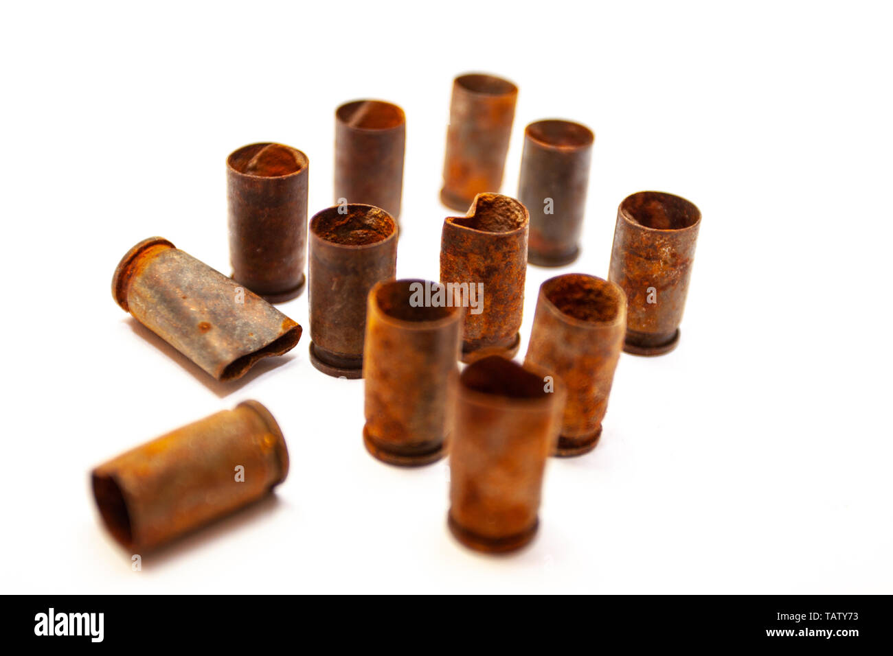 Empty bullet shells on a white background Stock Photo - Alamy