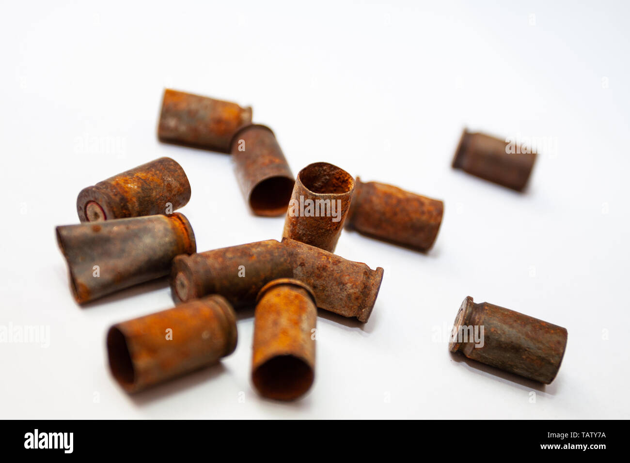 Empty bullet shells on a white background Stock Photo - Alamy
