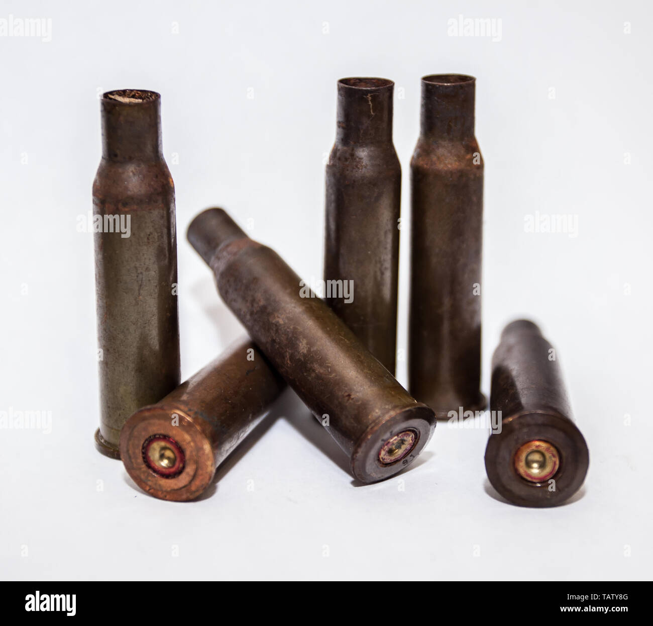 Empty bullet shells on a white background Stock Photo - Alamy