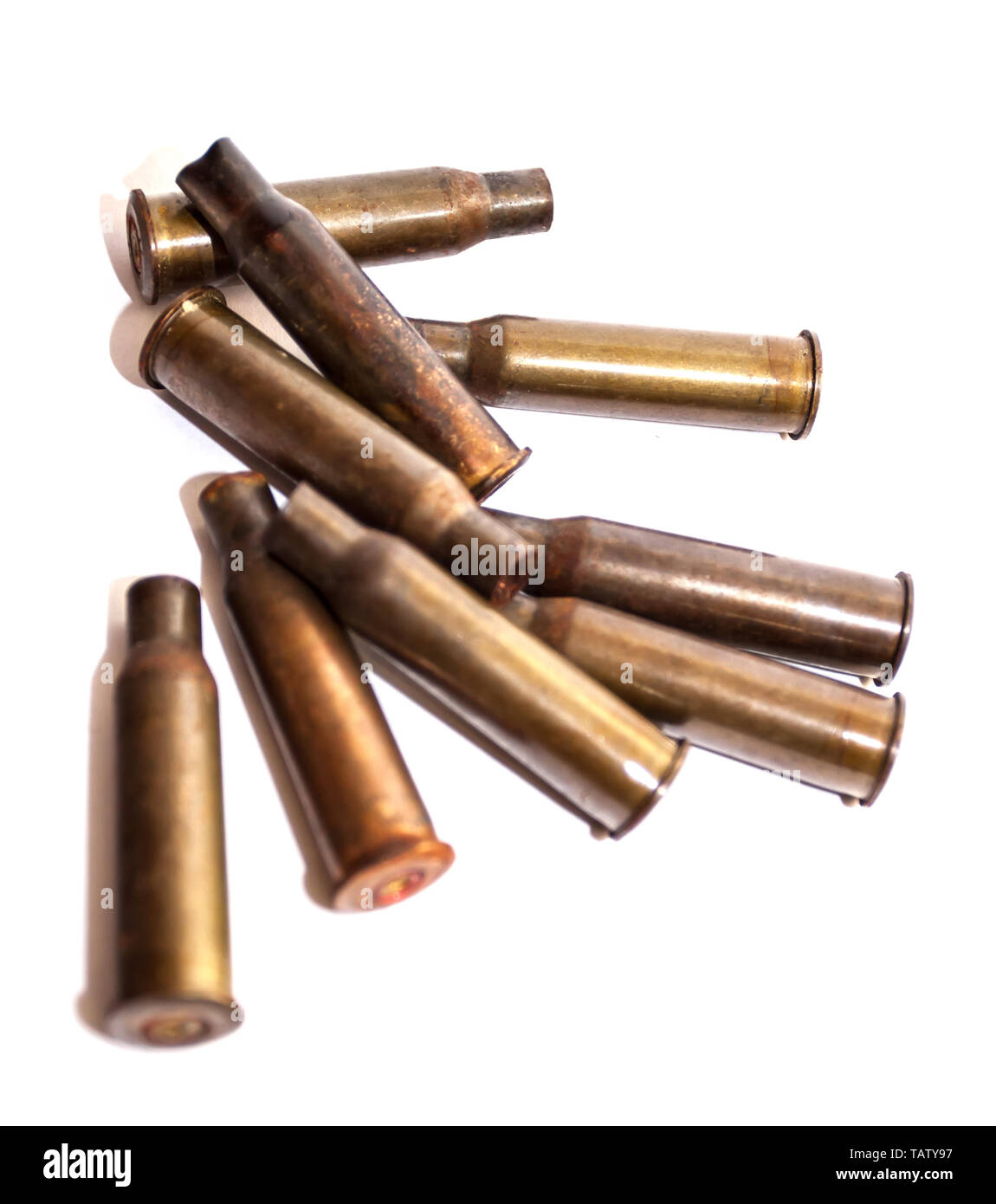 Empty bullet shells on a white background Stock Photo - Alamy