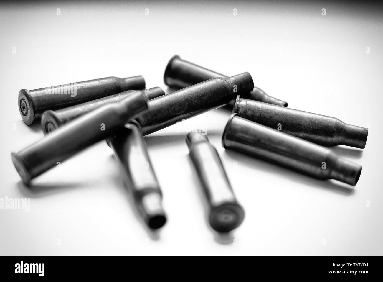 Empty bullet shells on a white background Stock Photo - Alamy
